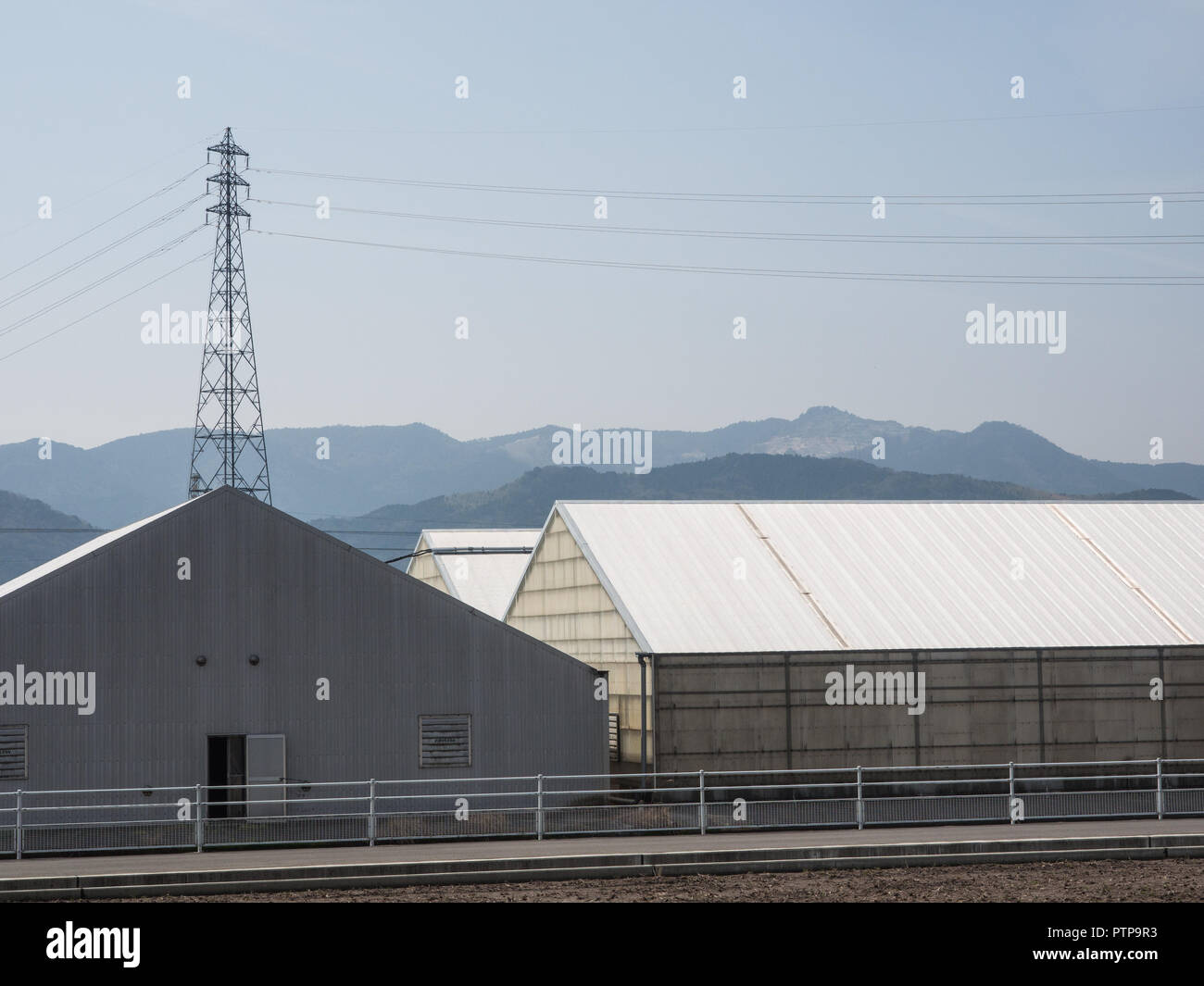 Sheds with metal roofs, power pylon, blue ridge hills, Takamatsu ...