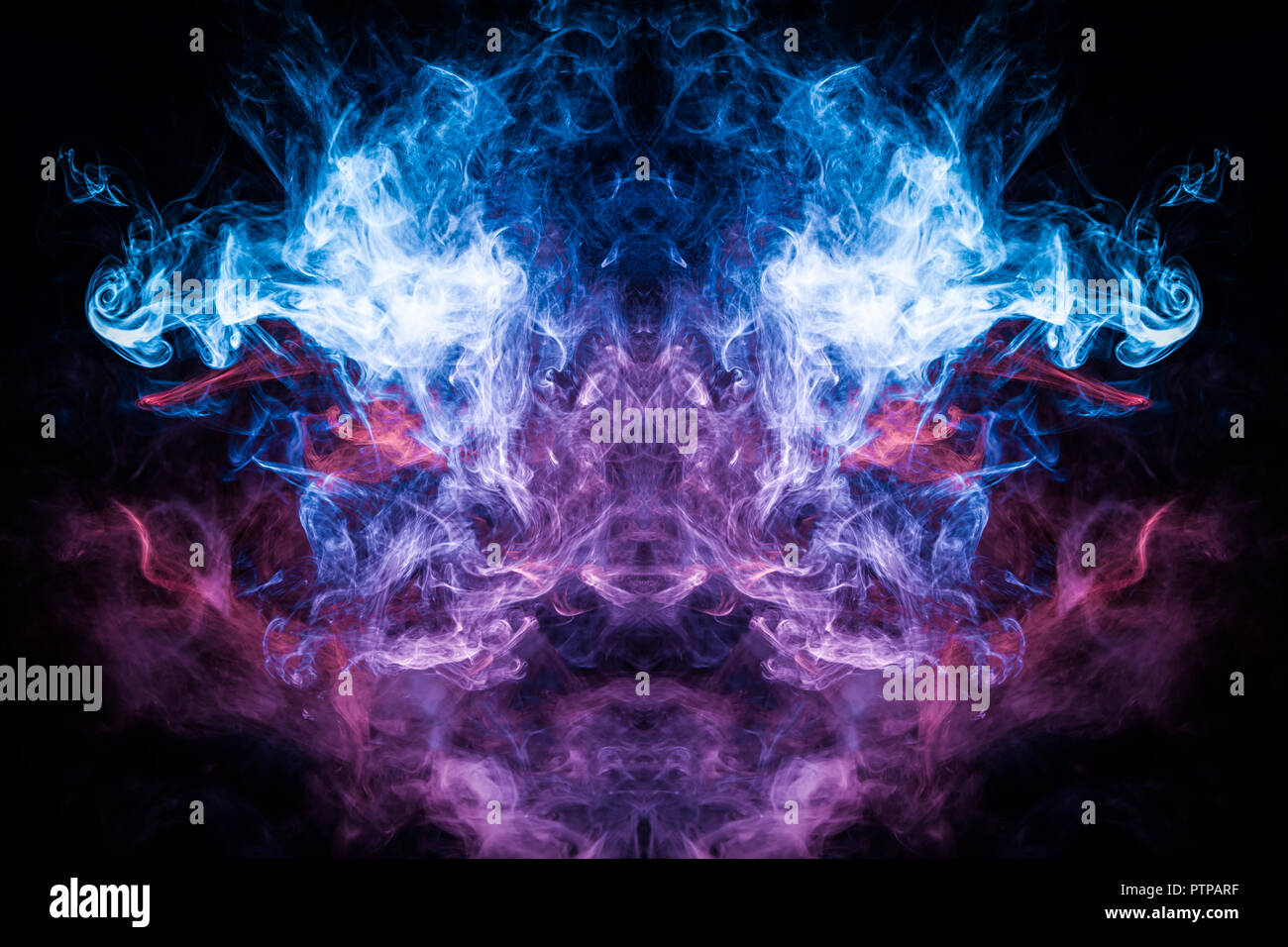 Dense multicolored smoke of blue and purple colors in the form of a ...