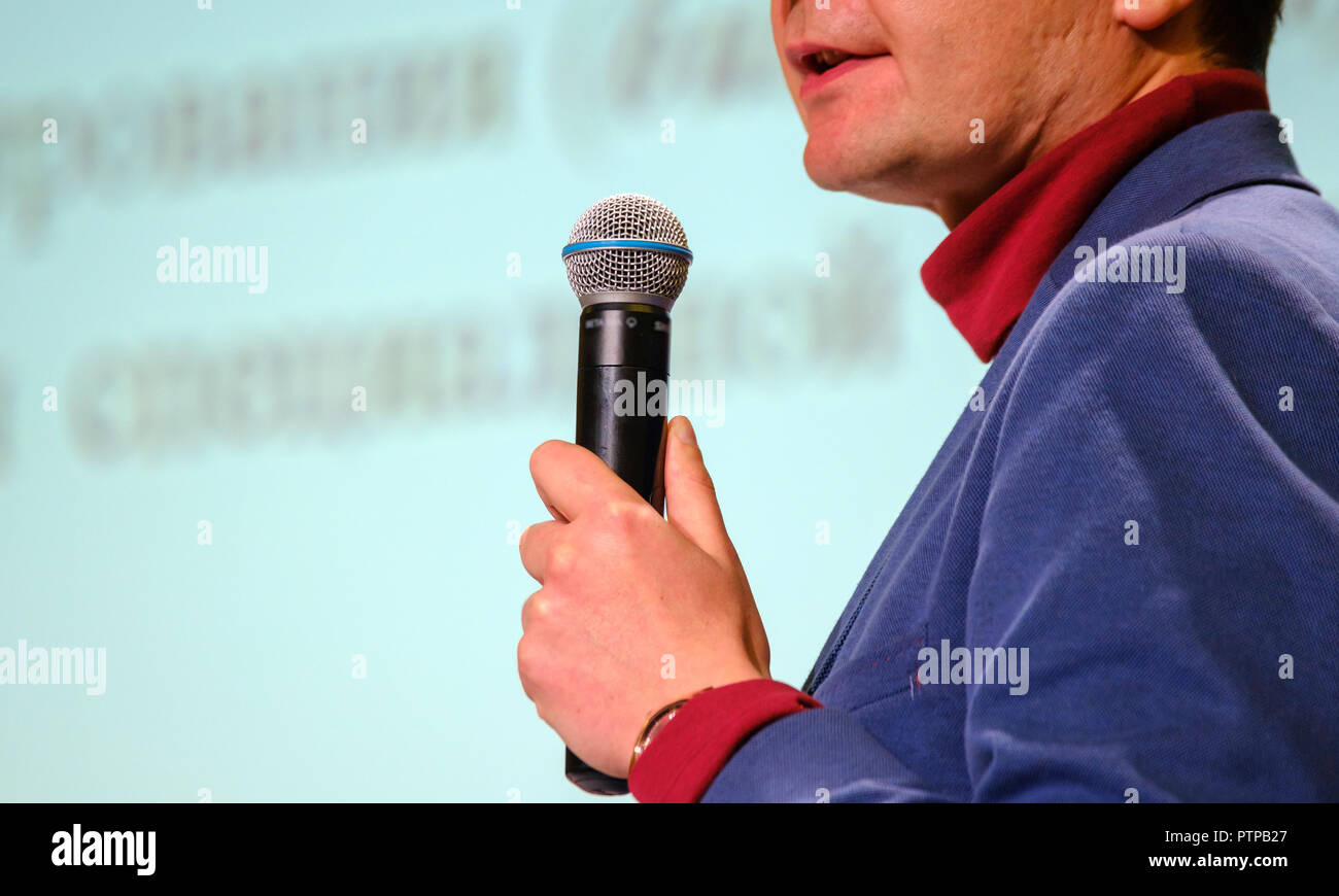 Holding microphone speaking in public hi-res stock photography and ...
