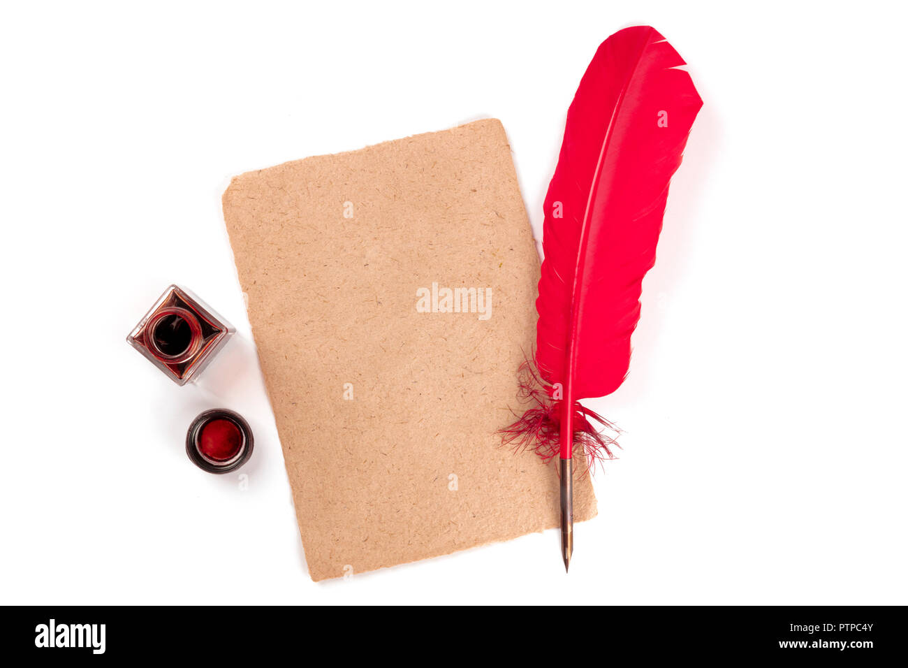 An overhead photo of an ink well with a piece of old parchment, with a ...