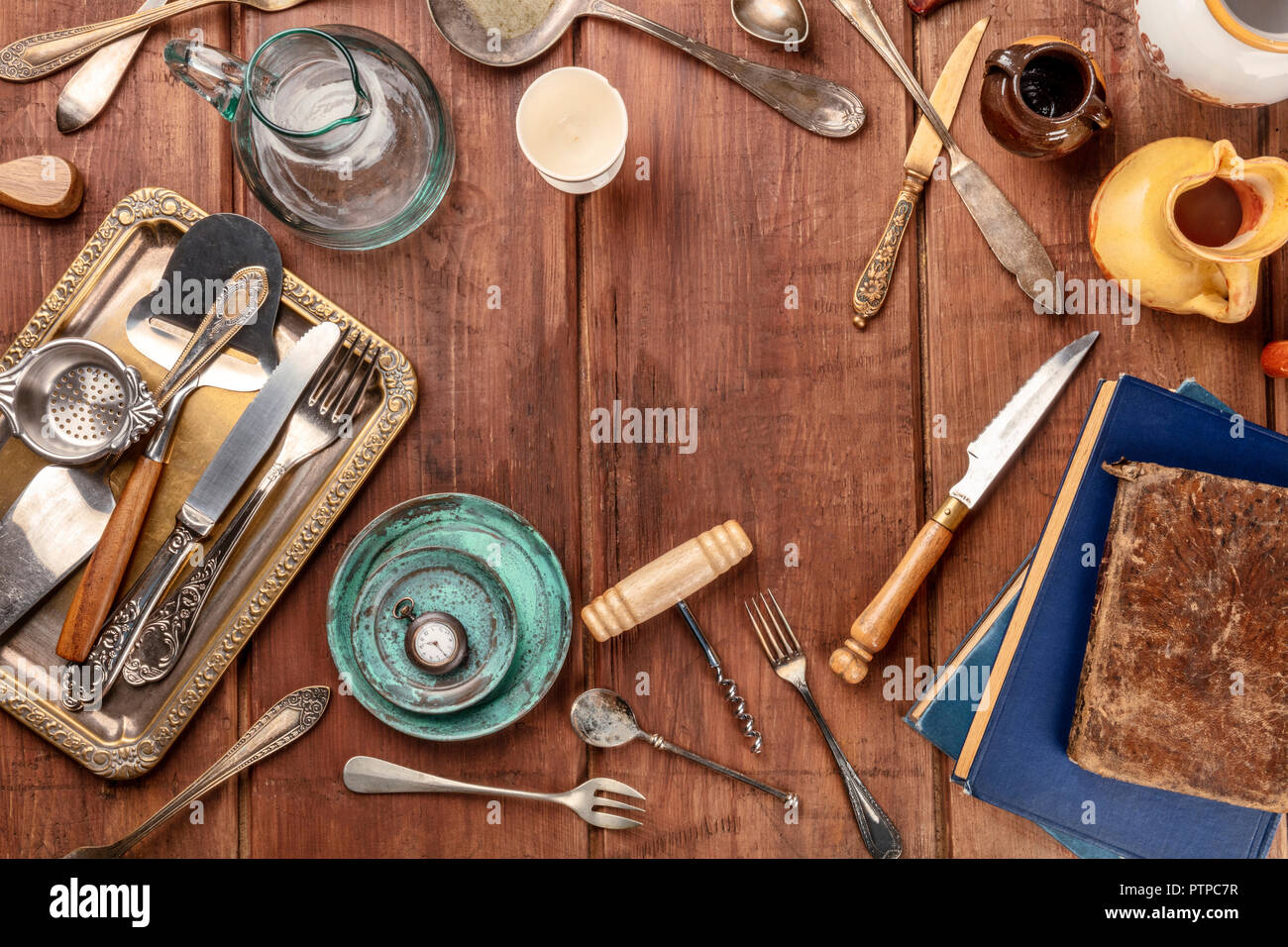 An overhead photo of many vintage kitchen objects and cutlery from an ...