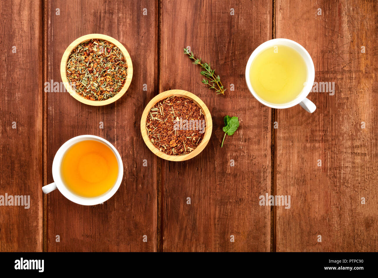 An overhead photo of tea, on a dark rustic background with copy space ...