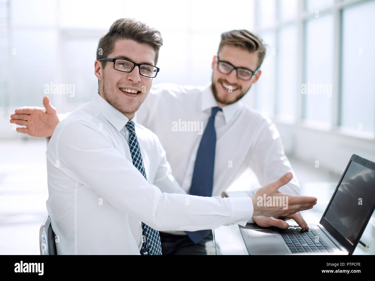close up.two successful employees in the workplace Stock Photo - Alamy