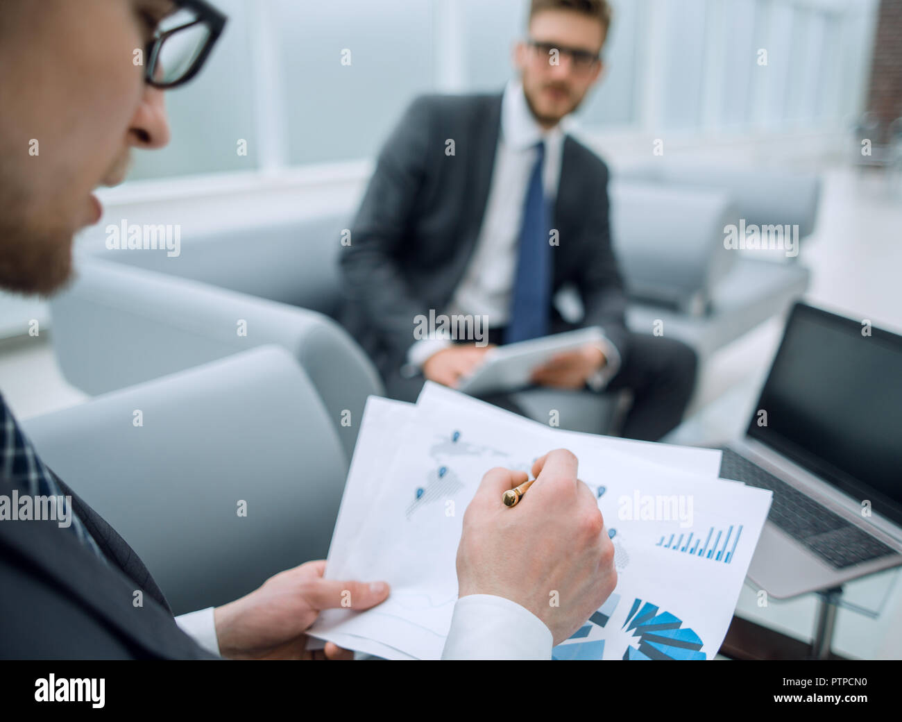 Business man checks chart financial hi-res stock photography and images ...