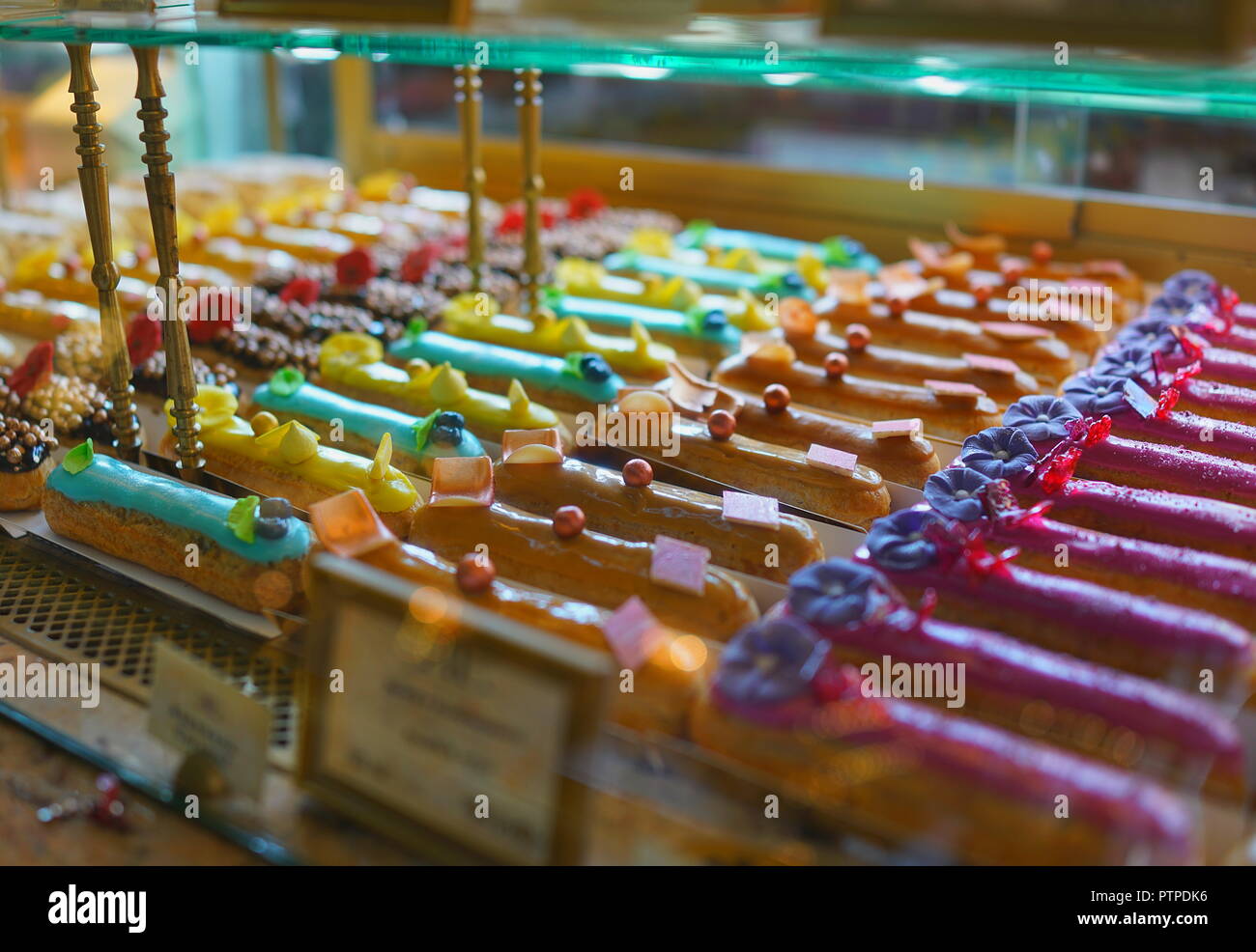 Colorful eclairs display in pastry shop Stock Photo - Alamy