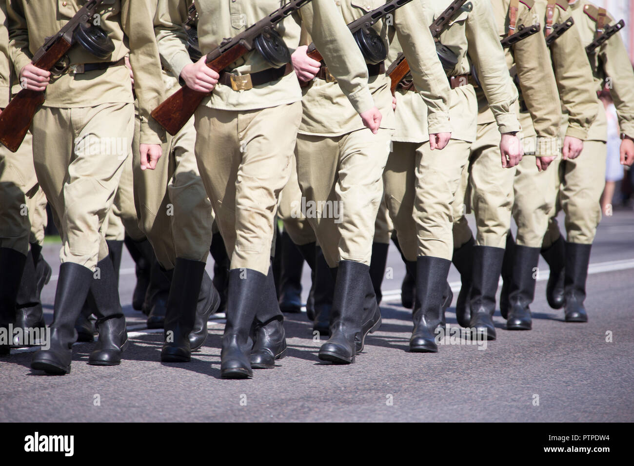 World War II soldiers marching down the street Stock Photo - Alamy