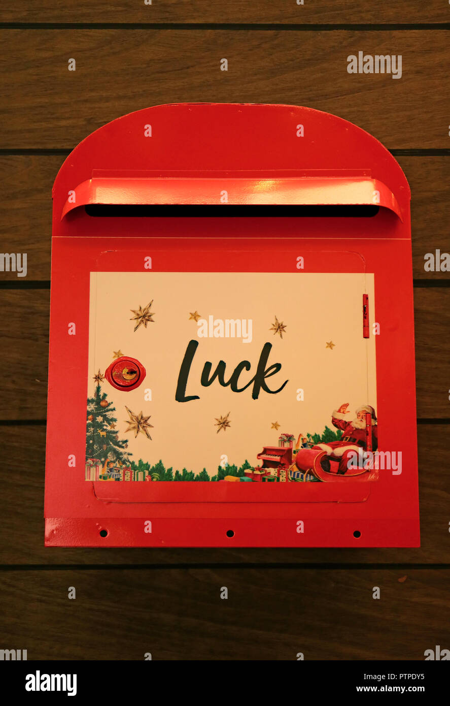 The Positive Word Luck on Vibrant Red Post Box Hanging on the Wooden ...
