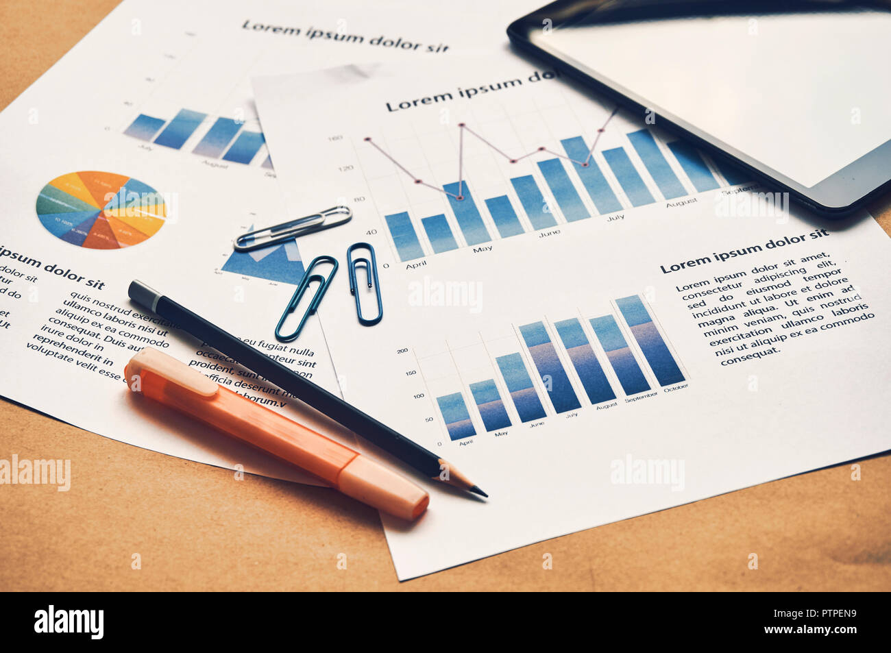 Closeup financial statistics document dummy report with pie graph, bar ...