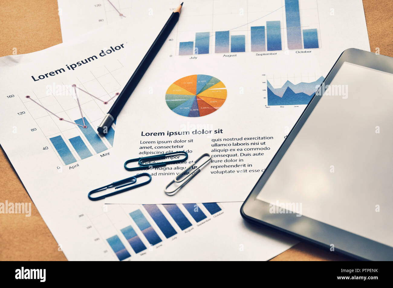 Business workplace desk with financial statistics dummy documents ...