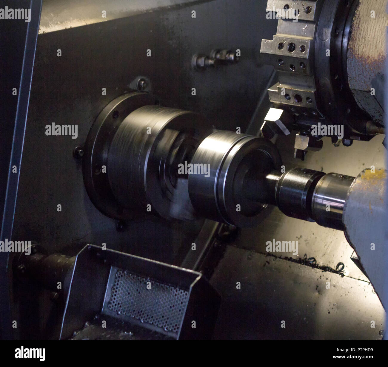 CNC lathe pulls out part of metal workpiece pulley, modern lathe for ...