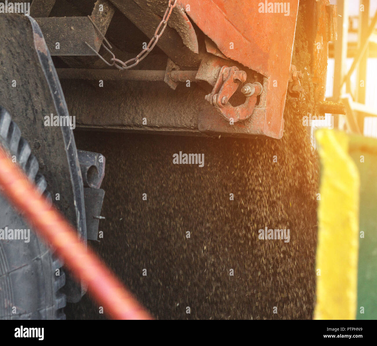 The truck unloads grain at the grain storage and processing plant, corn ...