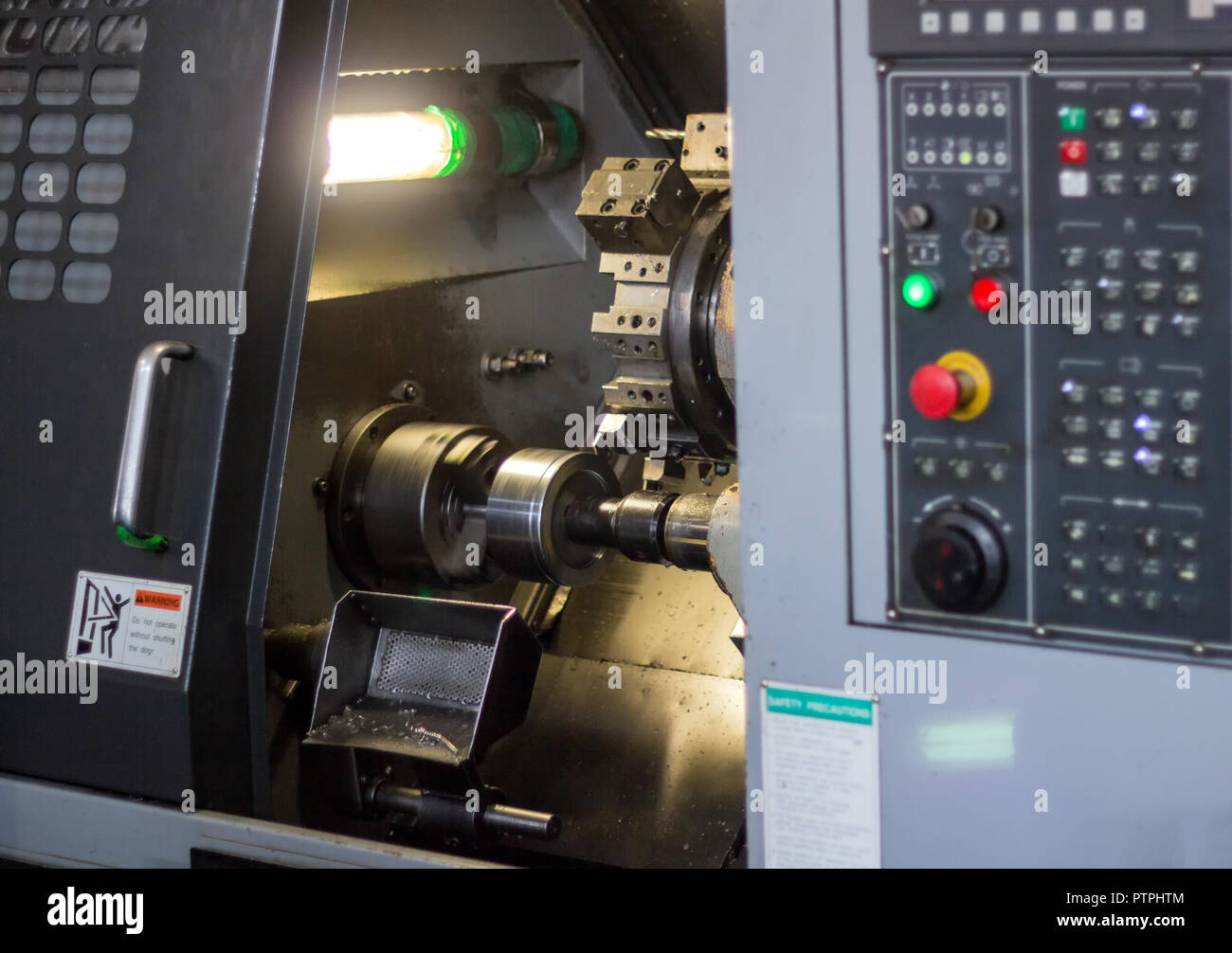 CNC lathe pulls out part of metal workpiece pulley, modern lathe for ...