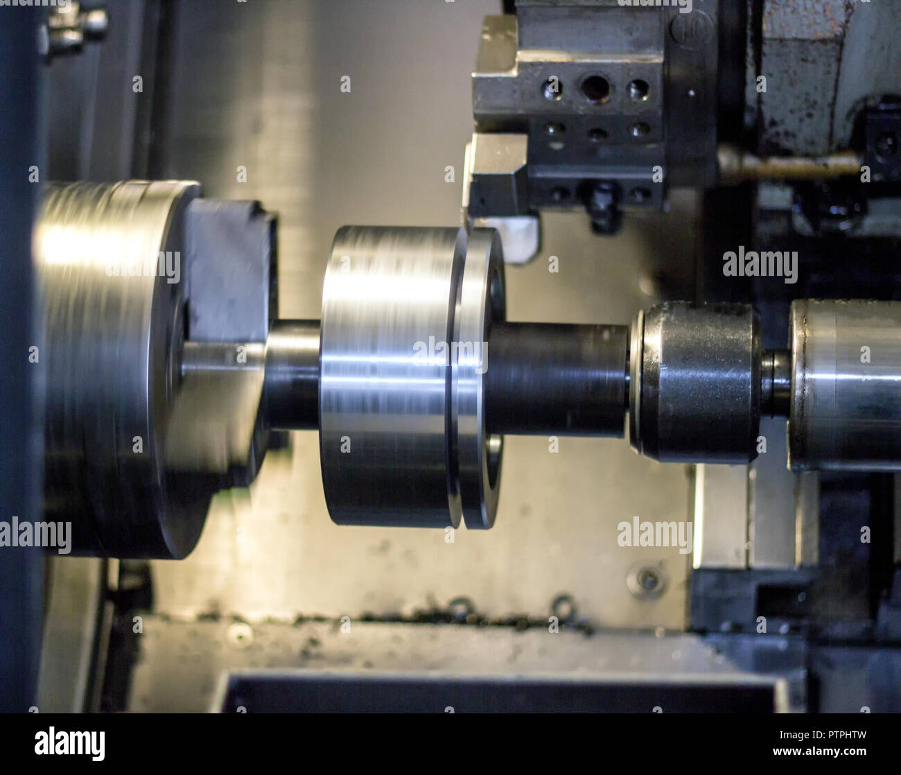 CNC lathe pulls out part of metal workpiece pulley, modern lathe for ...