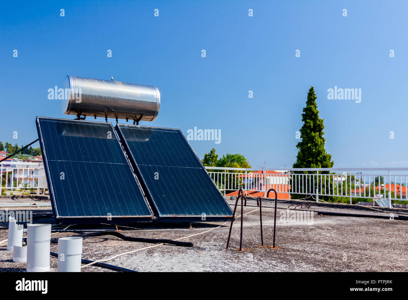 Water panels for using renewable sun energy are placed on house roof ...