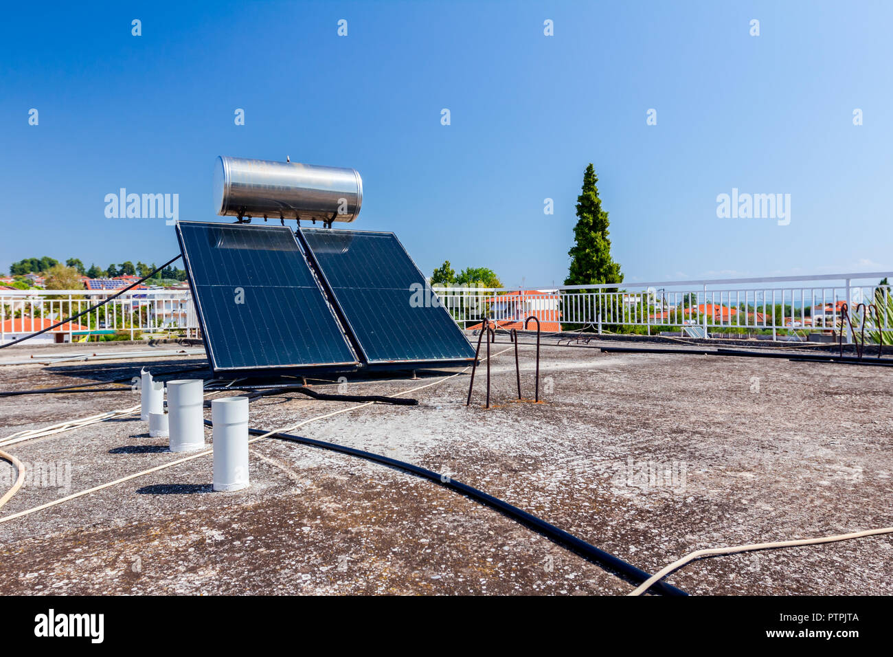 Water panels for using renewable sun energy are placed on house roof ...