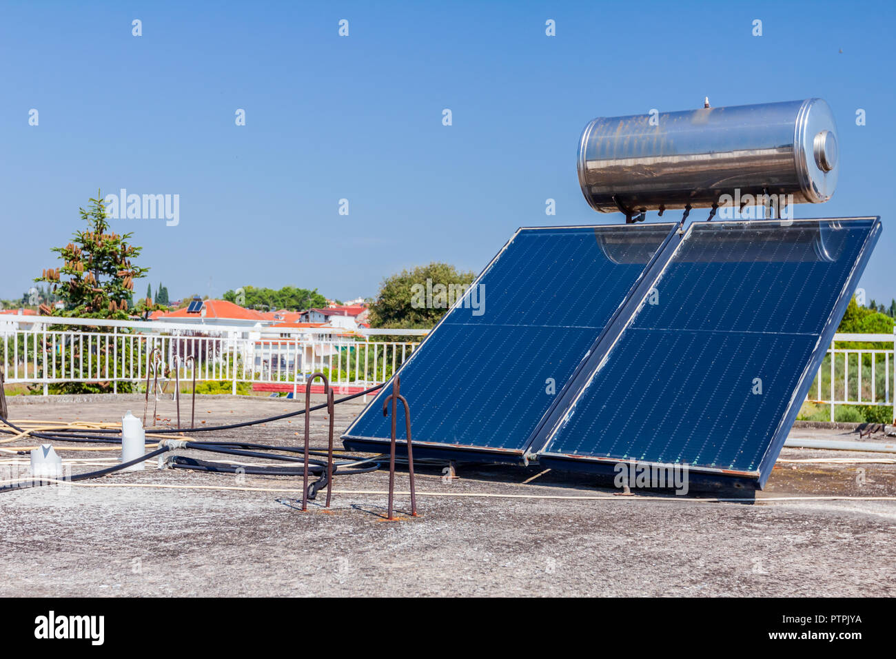 Water panels for using renewable sun energy are placed on house roof ...