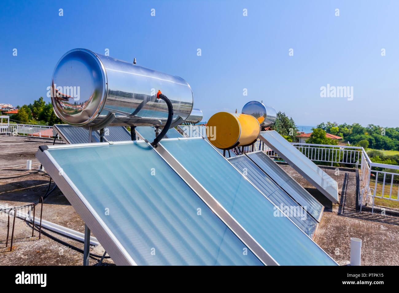 Water panels for using renewable sun energy are placed on house roof ...