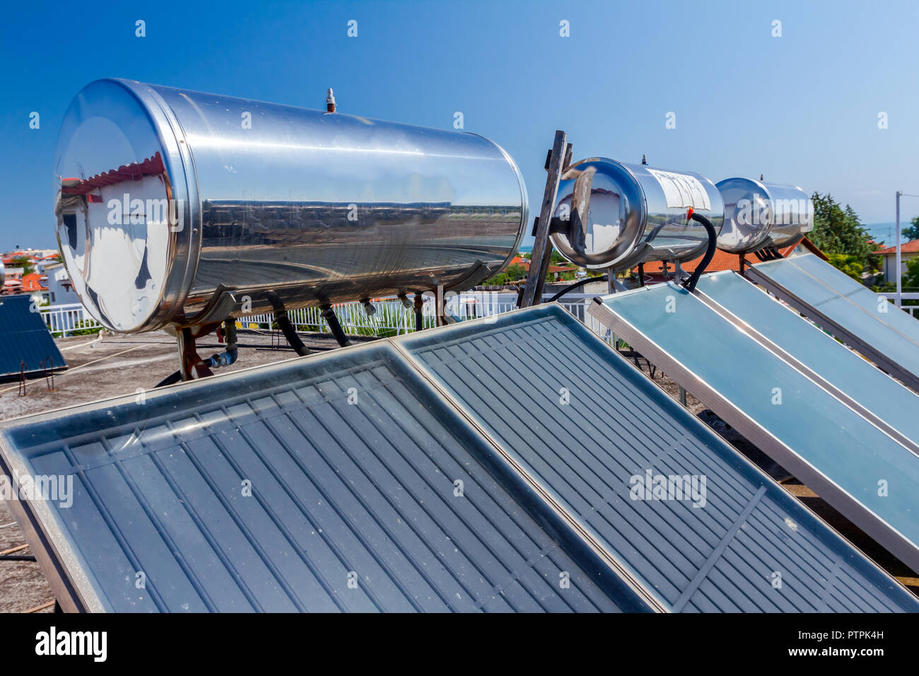 Water panels for using renewable sun energy are placed on house roof ...