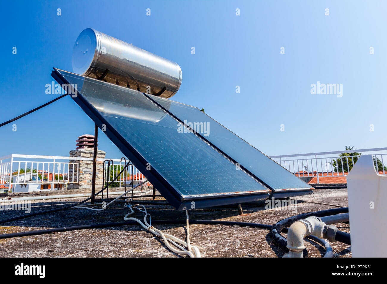 Water panels for using renewable sun energy are placed on house roof ...