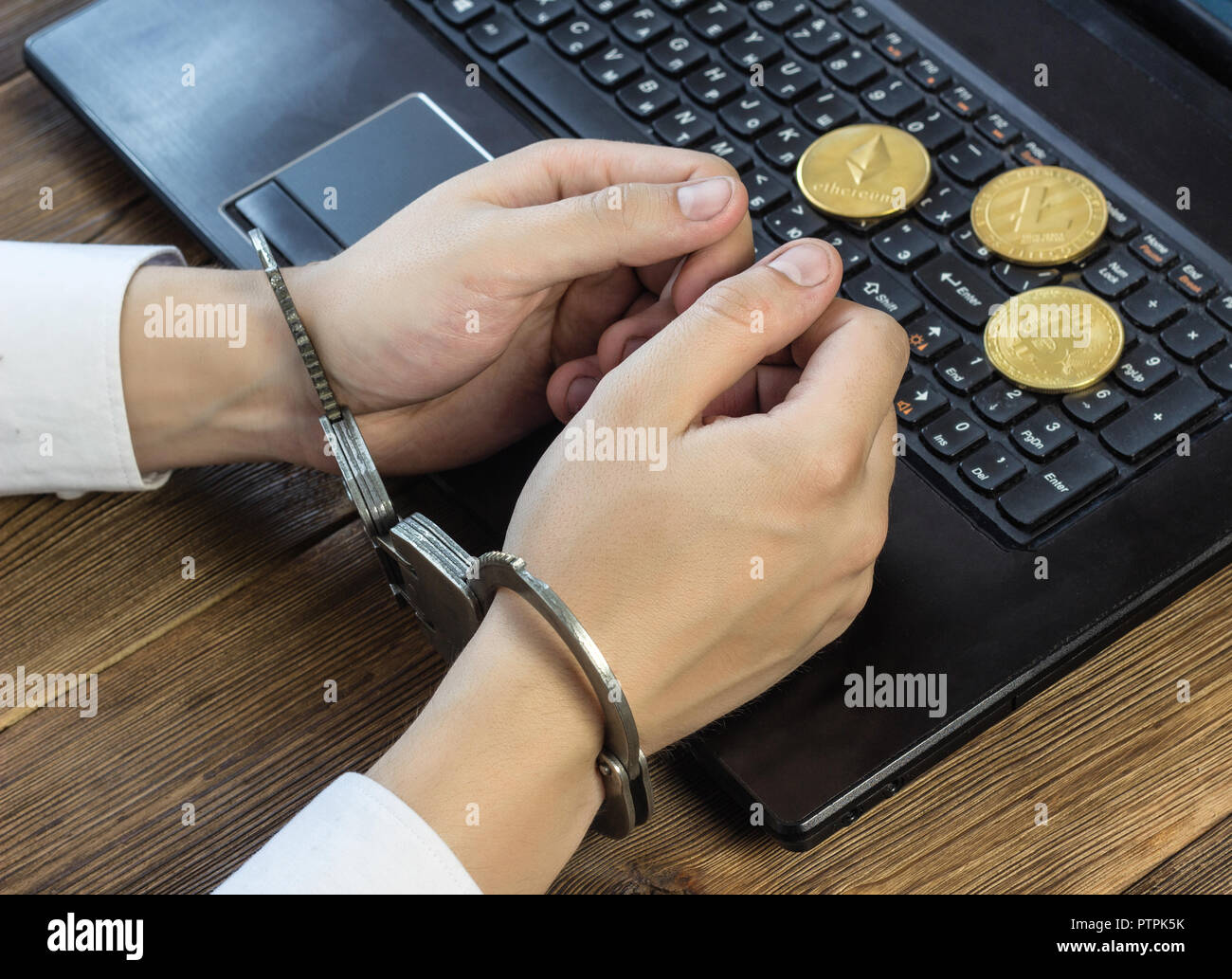 Hands in handcuffs hi-res stock photography and images - Alamy
