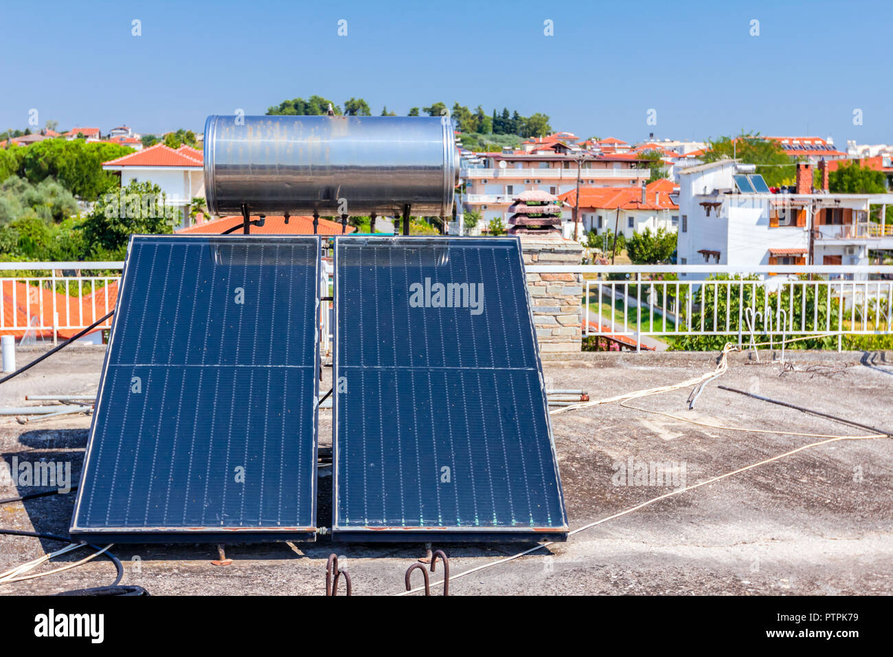 Water panels for using renewable sun energy are placed on house roof ...