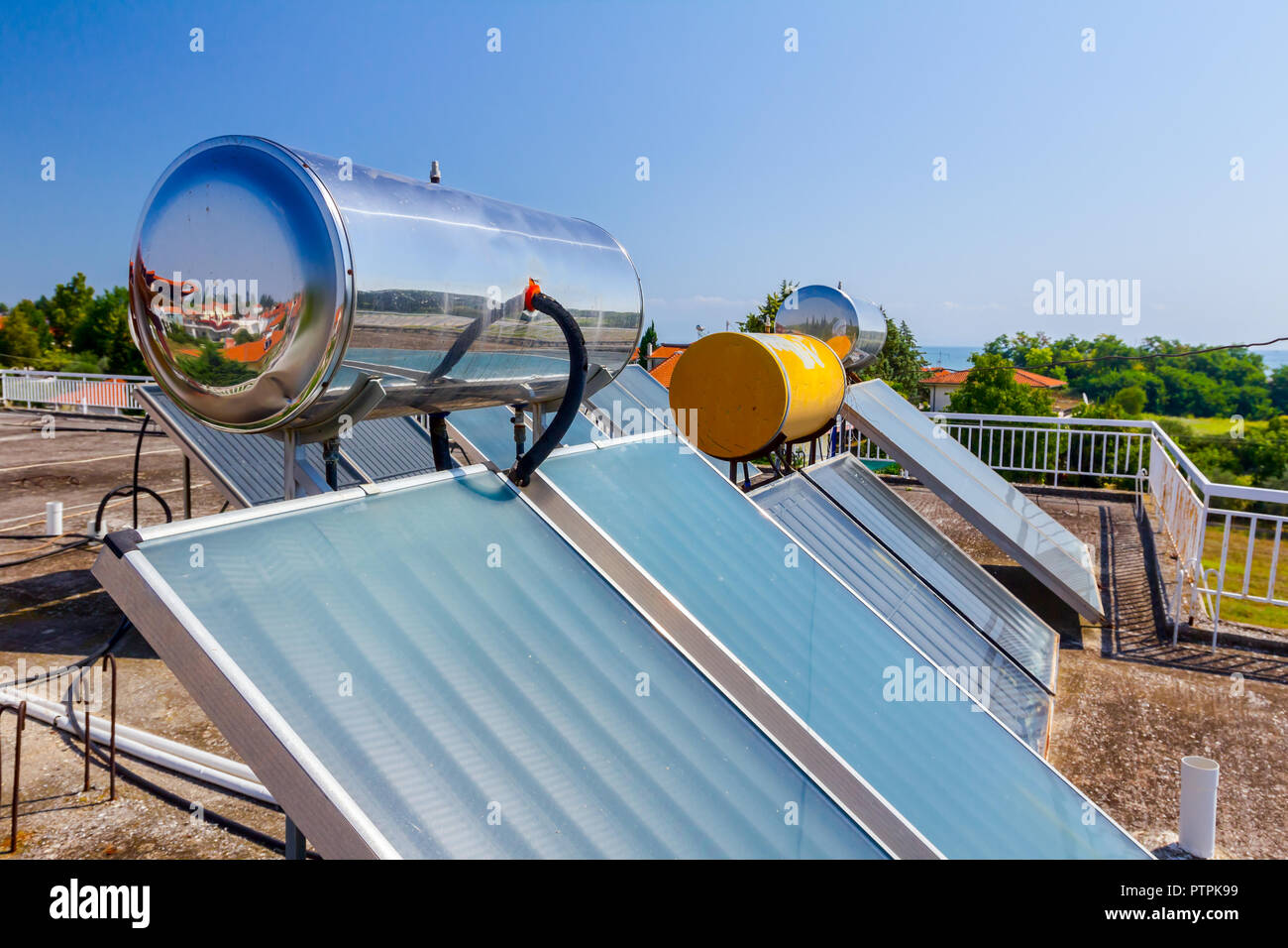 Water panels for using renewable sun energy are placed on house roof ...