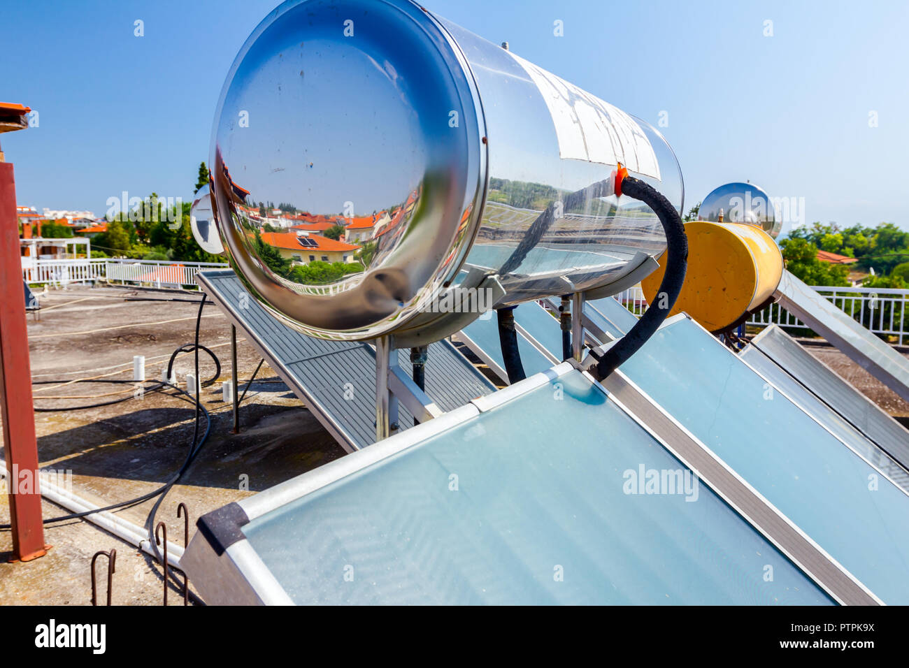 Water panels for using renewable sun energy are placed on house roof ...