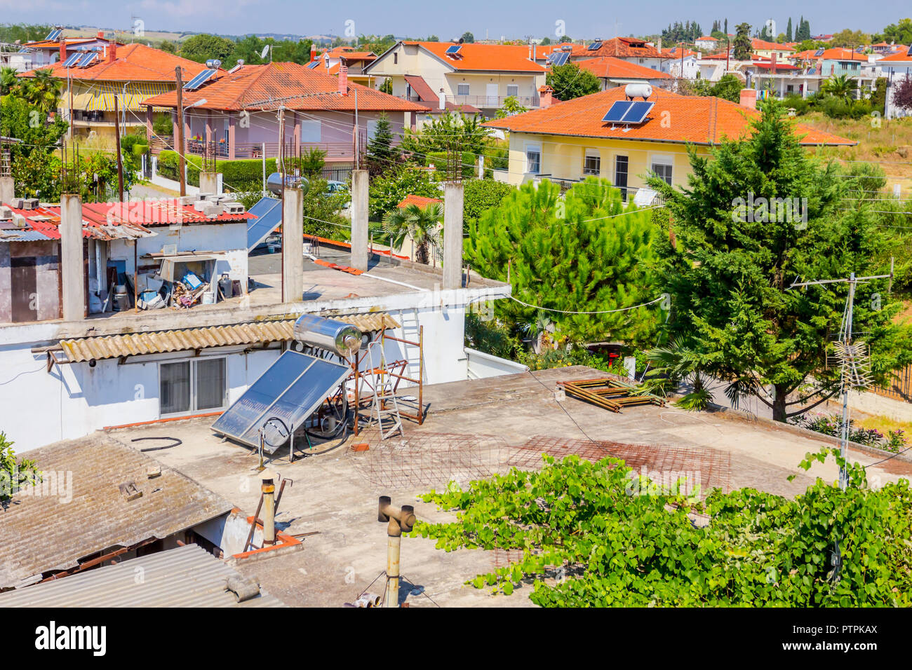 Water panels for using renewable sun energy are placed on house roof ...