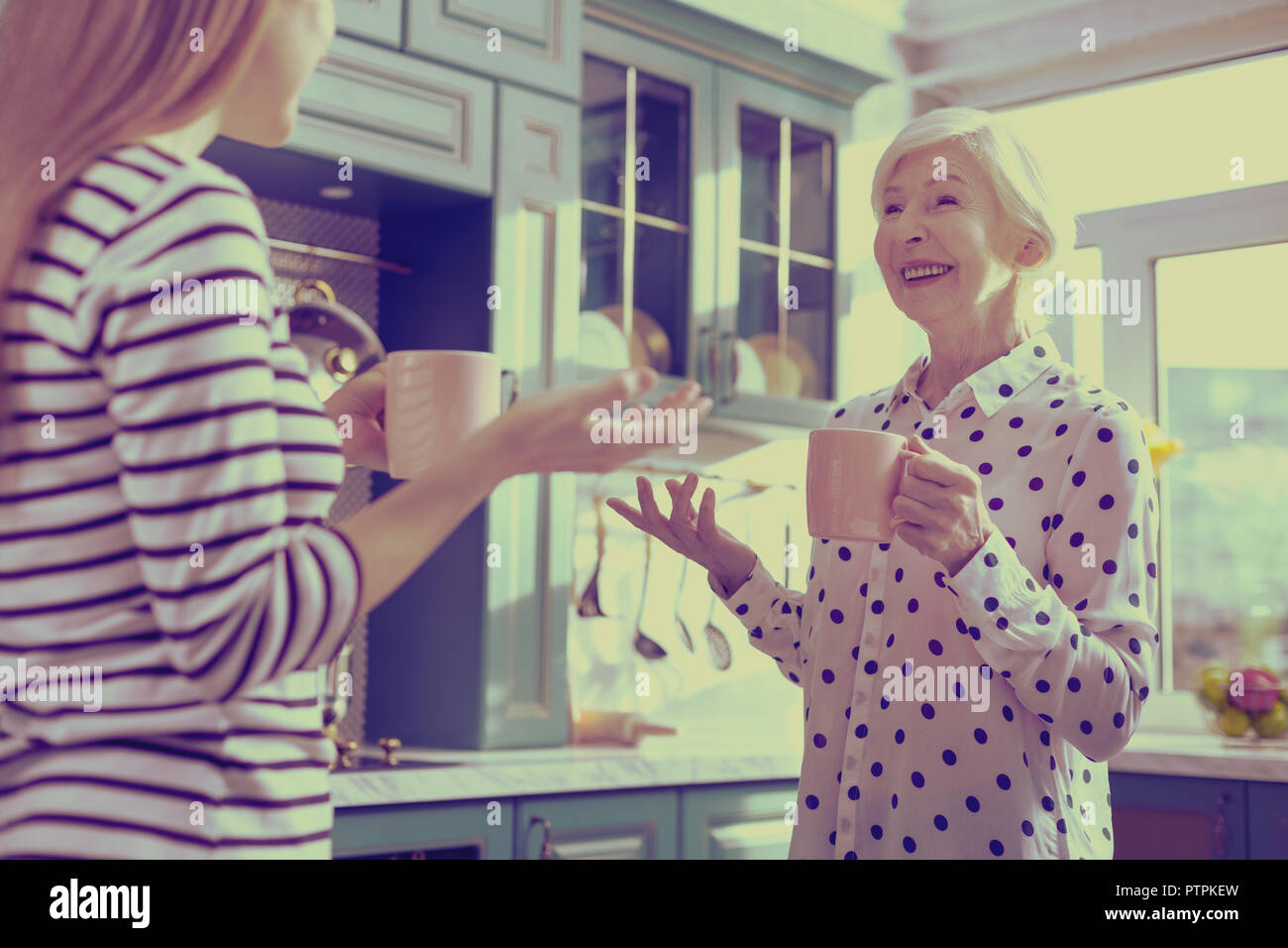 Positive delighted females having time for gossips Stock Photo - Alamy