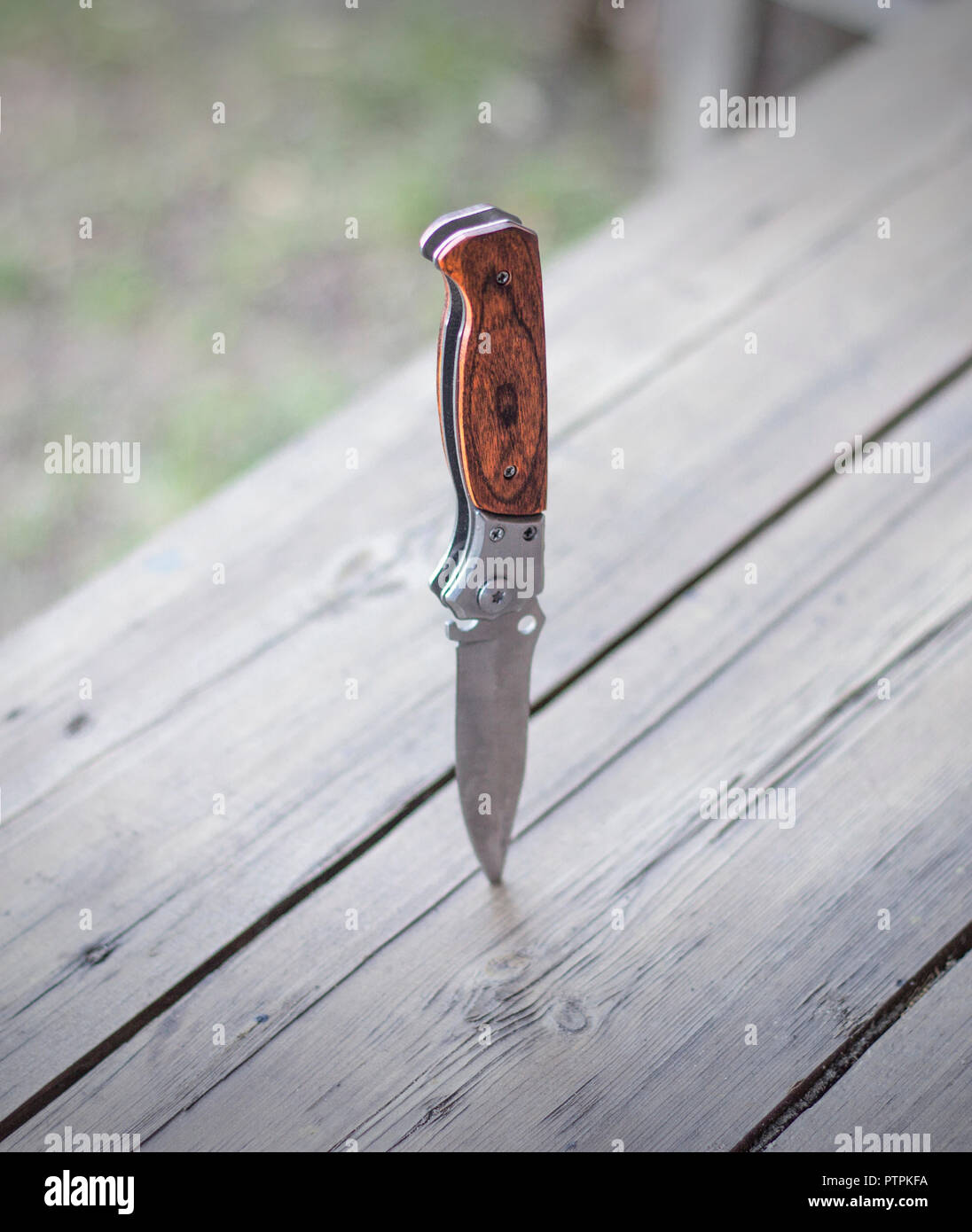 Knife stuck in table hi-res stock photography and images - Alamy