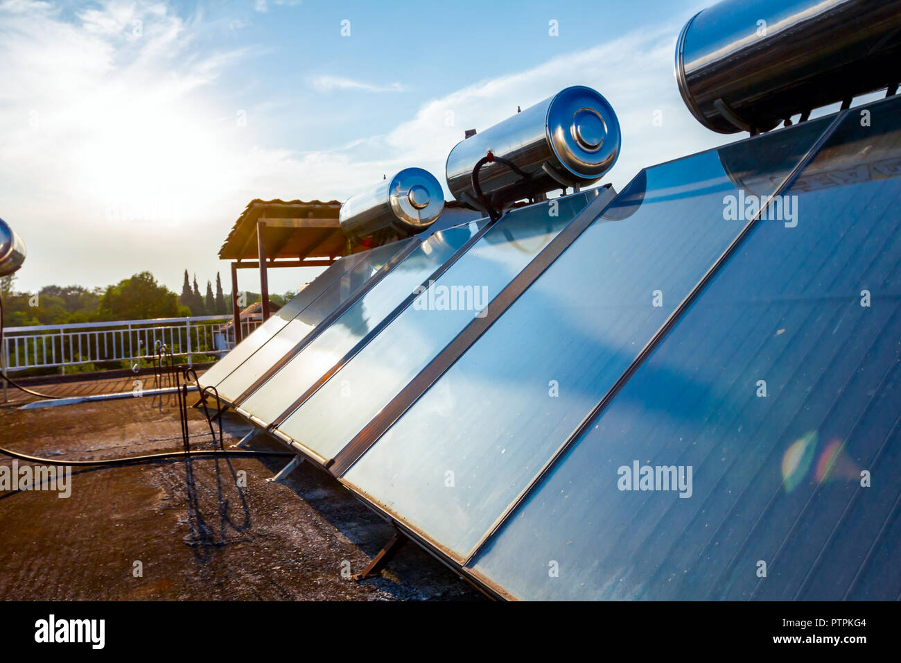 Water panels for using renewable sun energy are placed on house roof ...