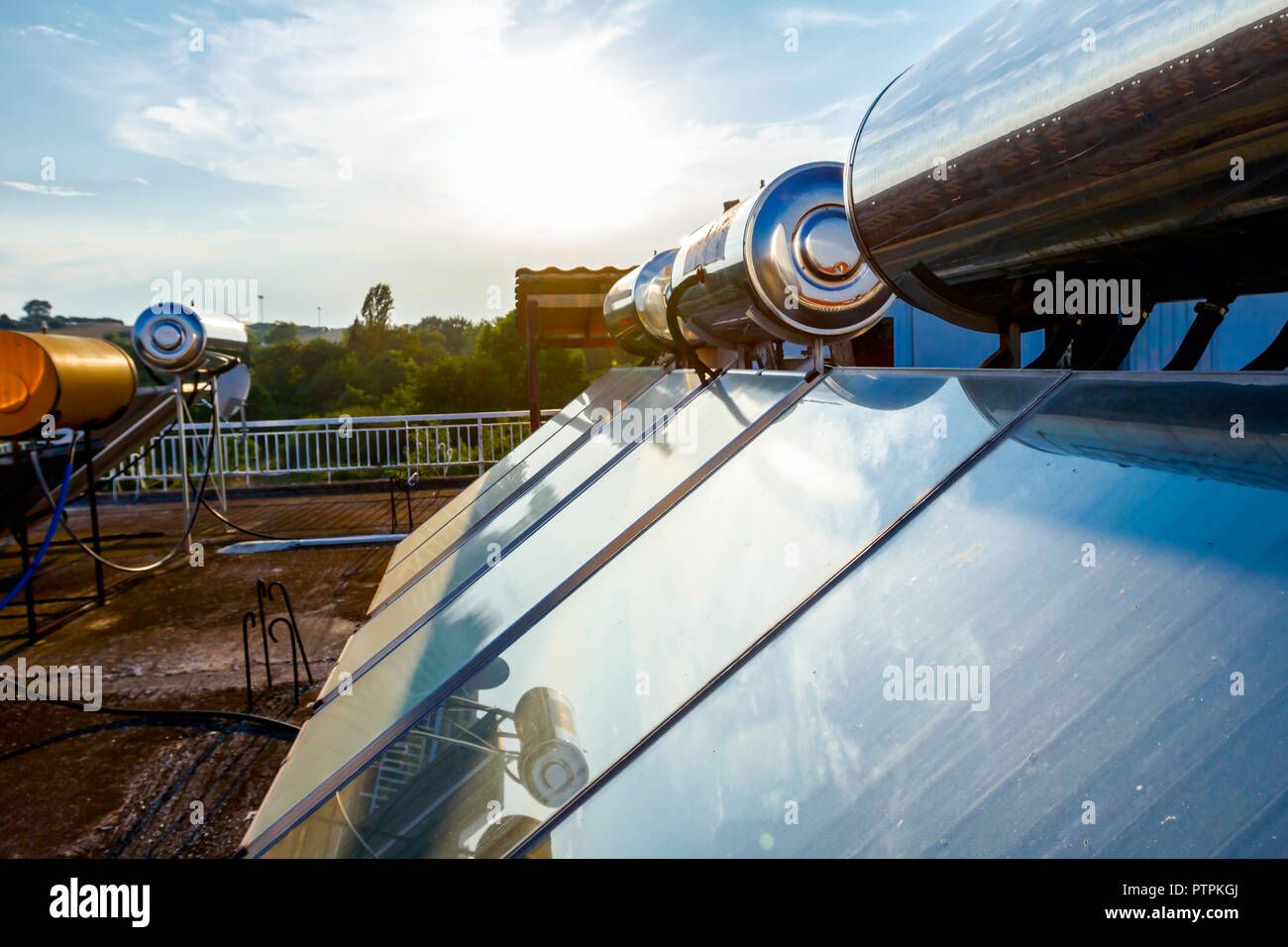 Water panels for using renewable sun energy are placed on house roof ...