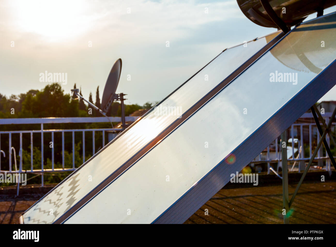 Water panels for using renewable sun energy are placed on house roof ...