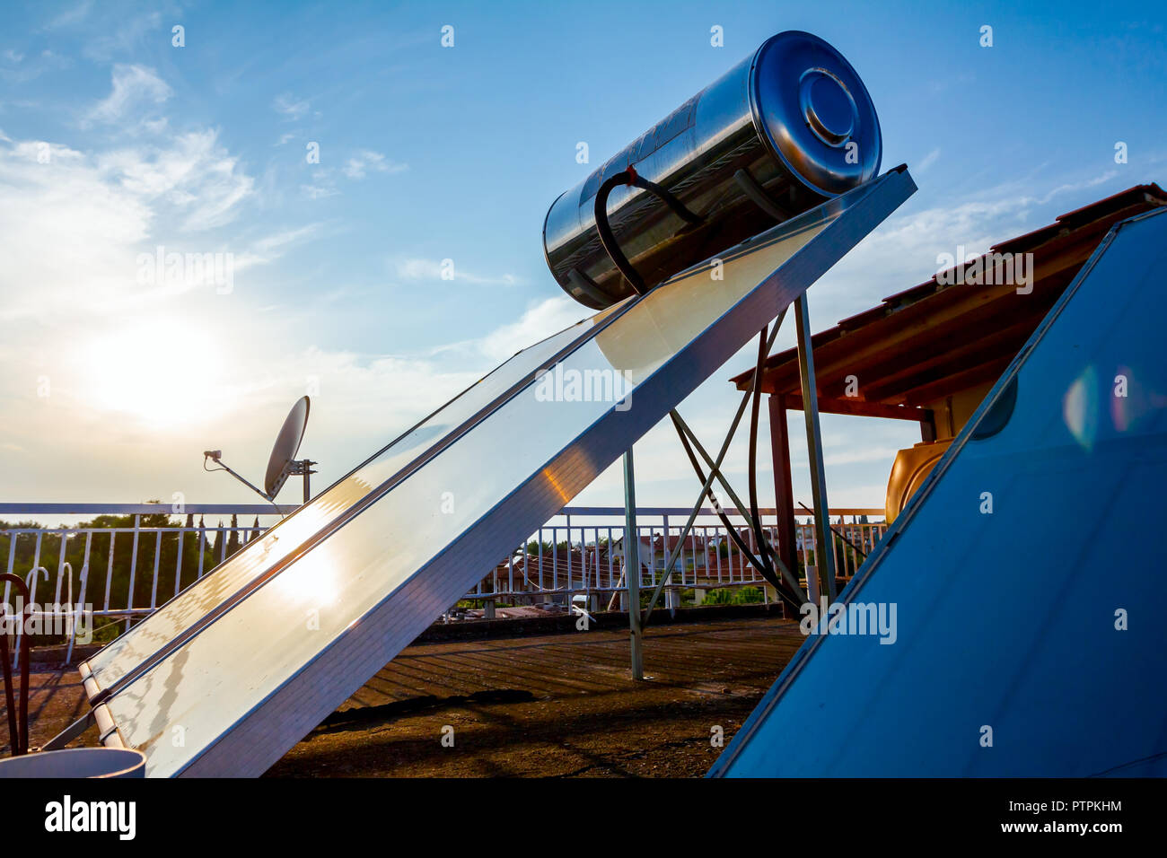 Water panels for using renewable sun energy are placed on house roof ...