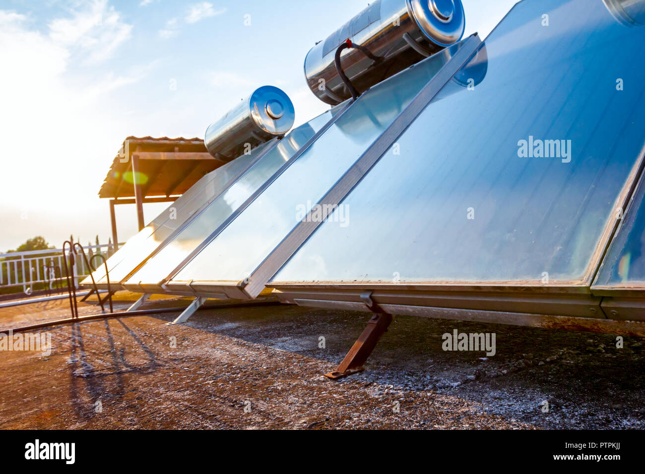 Water panels for using renewable sun energy are placed on house roof ...