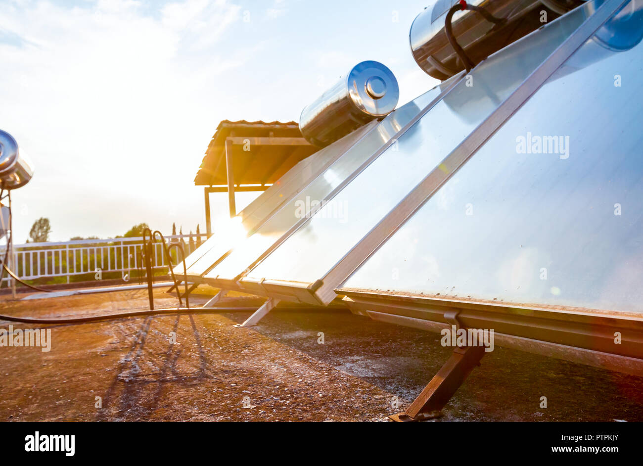 Water panels for using renewable sun energy are placed on house roof ...