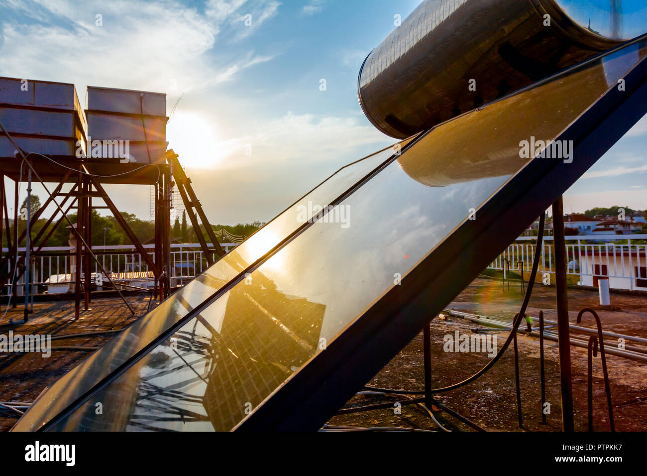 Water panels for using renewable sun energy are placed on house roof ...