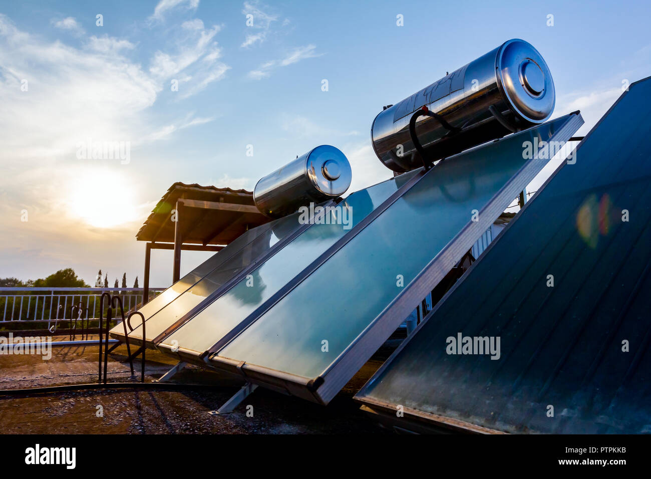 Water panels for using renewable sun energy are placed on house roof ...