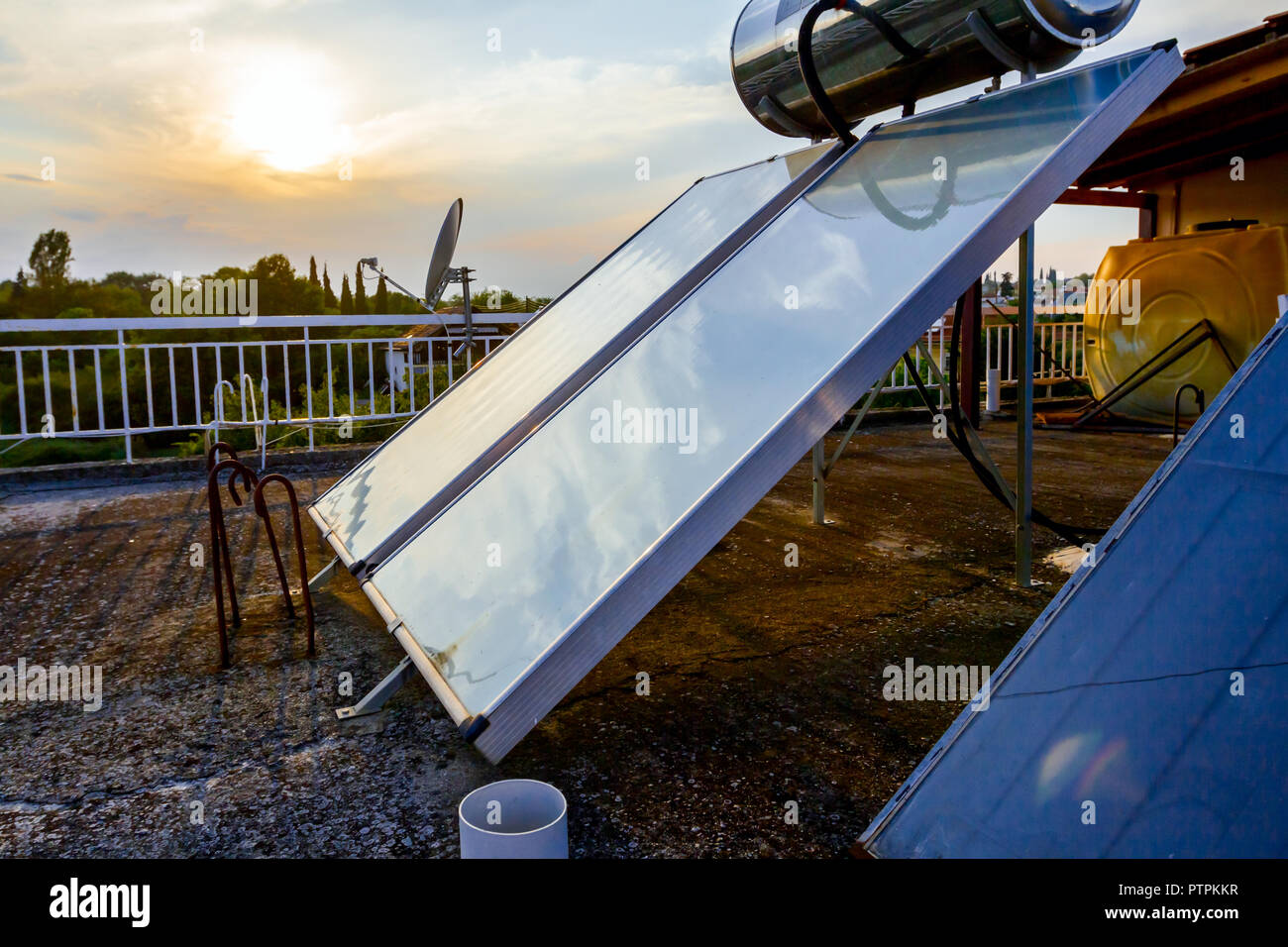 Water panels for using renewable sun energy are placed on house roof ...