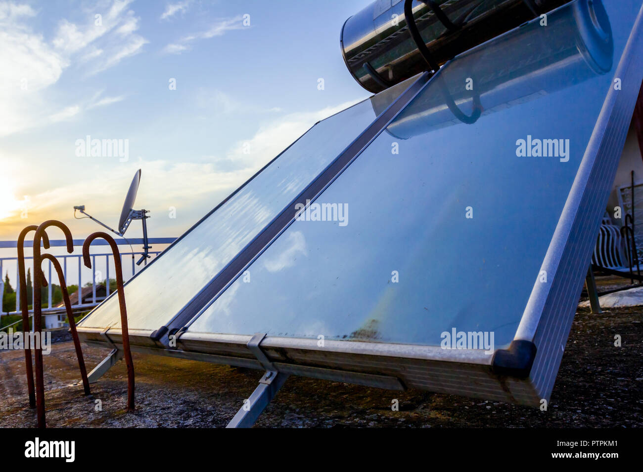 Water panels for using renewable sun energy are placed on house roof ...