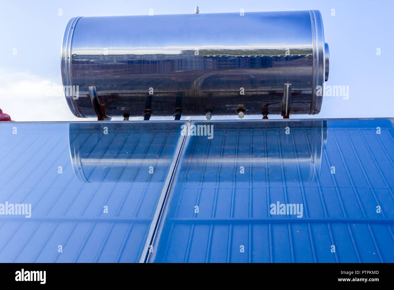 Water panels for using renewable sun energy are placed on house roof ...
