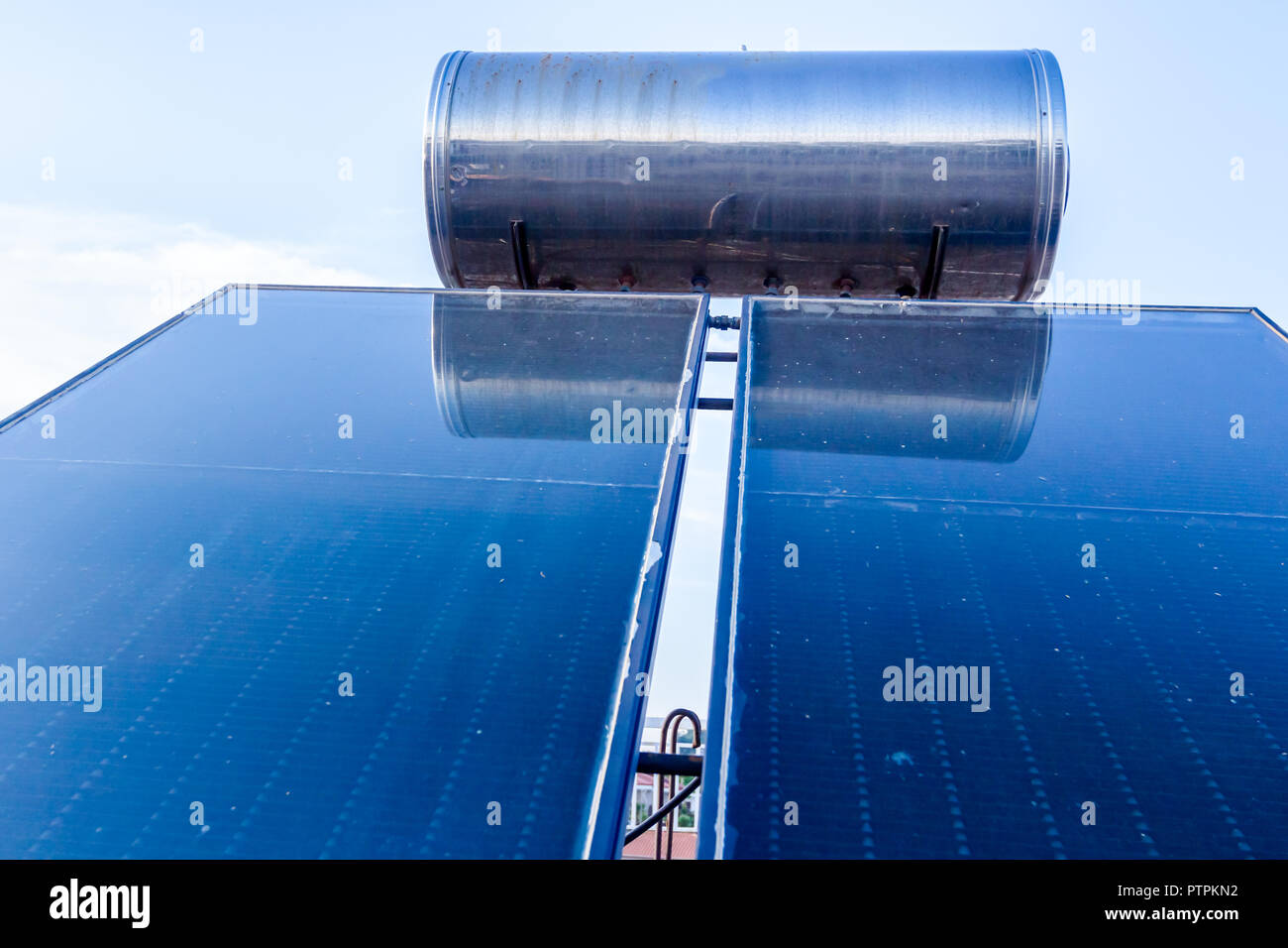 Water panels for using renewable sun energy are placed on house roof ...