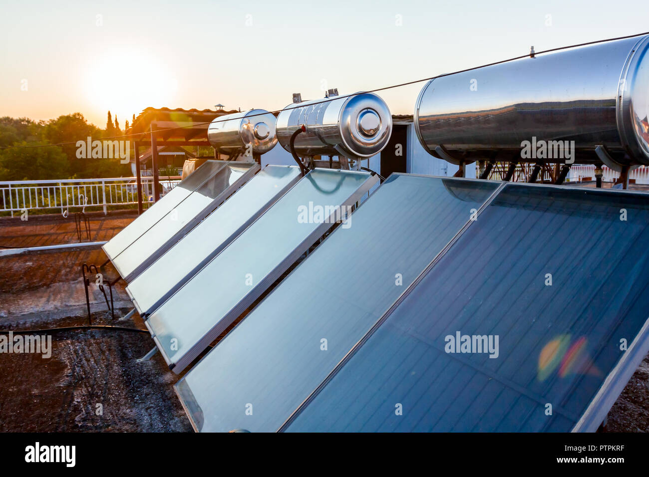 Water panels for using renewable sun energy are placed on house roof ...