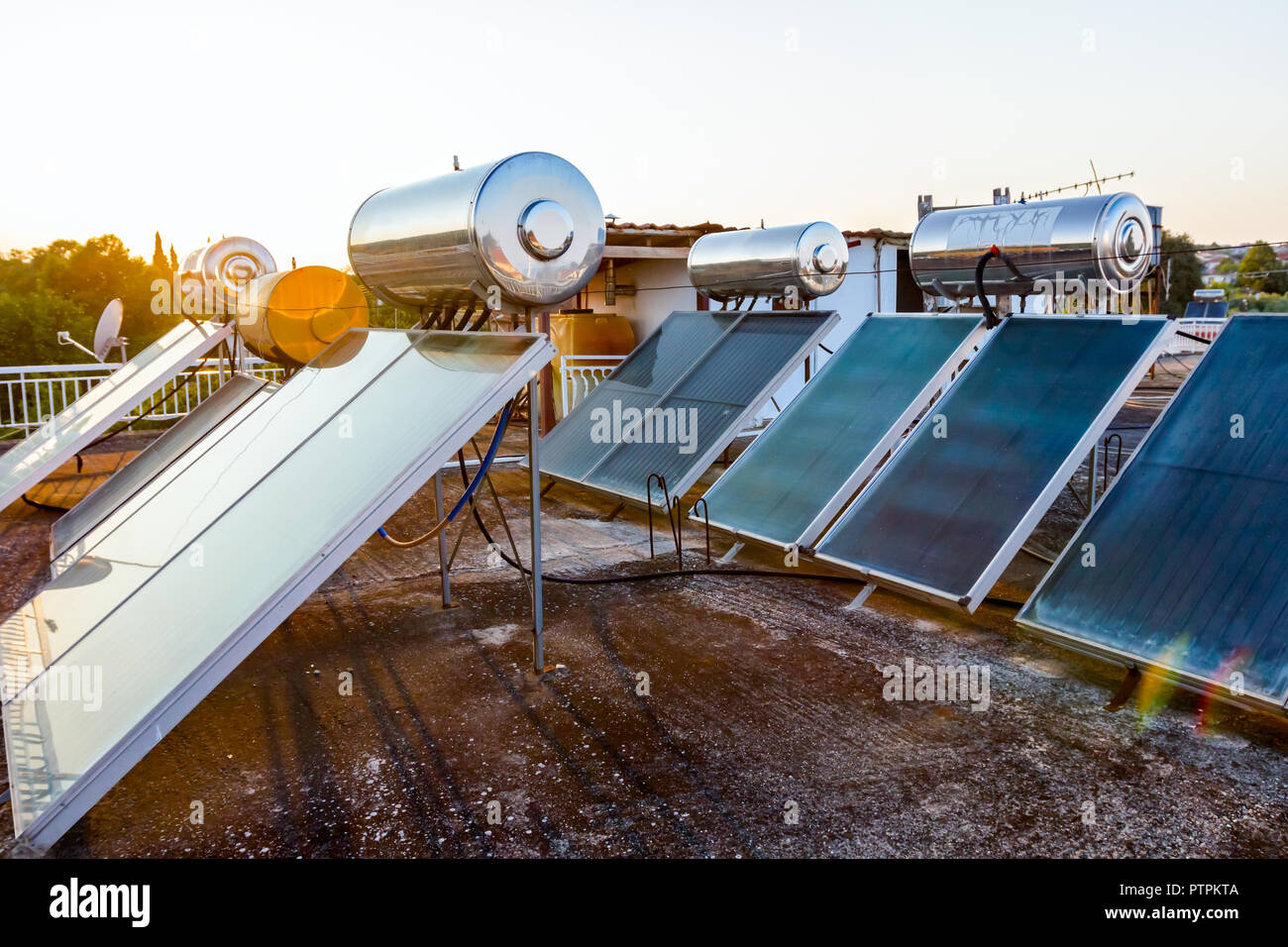 Water panels for using renewable sun energy are placed on house roof ...