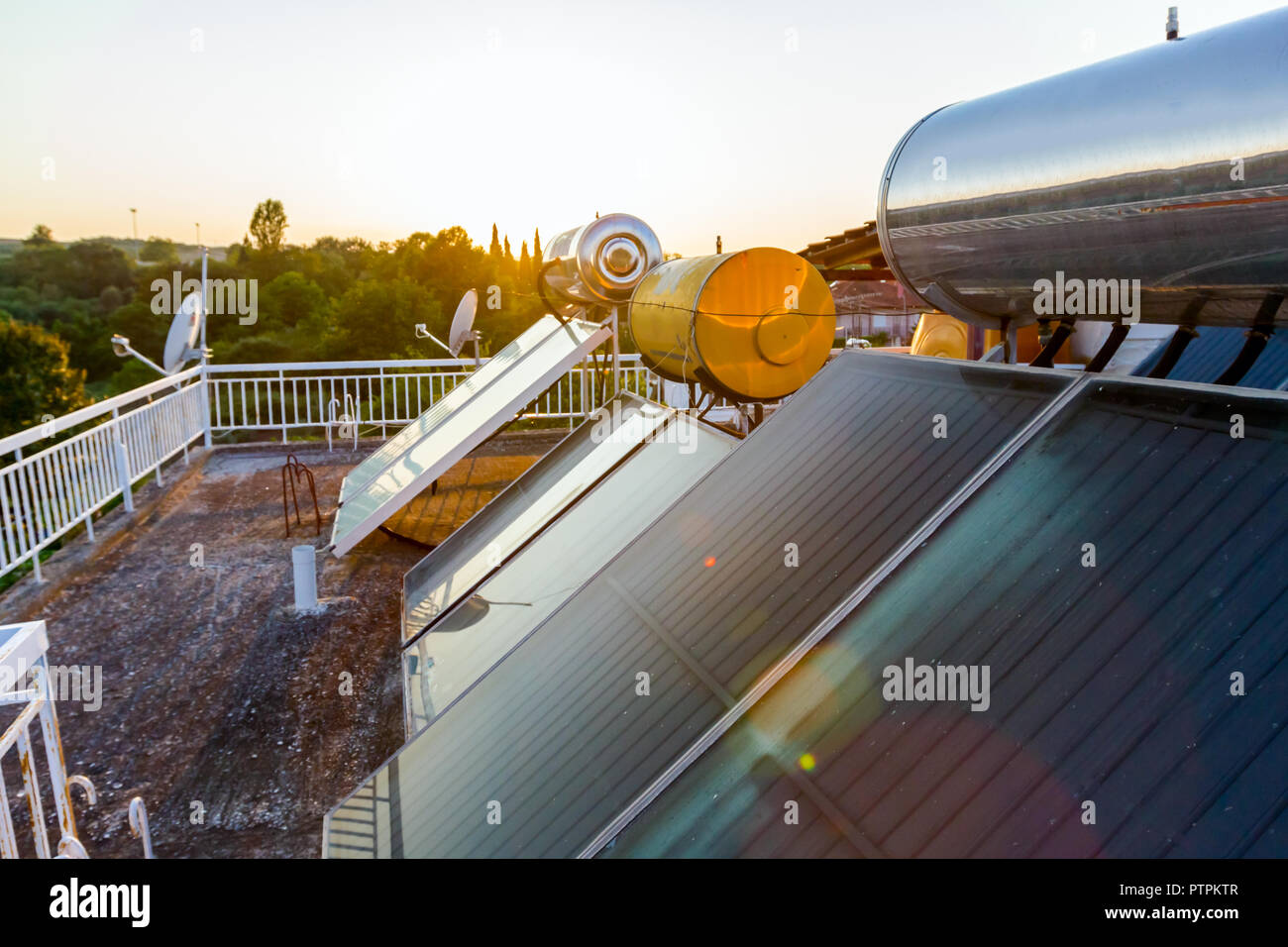 Water panels for using renewable sun energy are placed on house roof ...