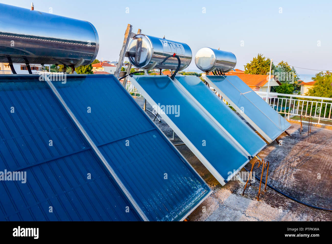 Water panels for using renewable sun energy are placed on house roof ...
