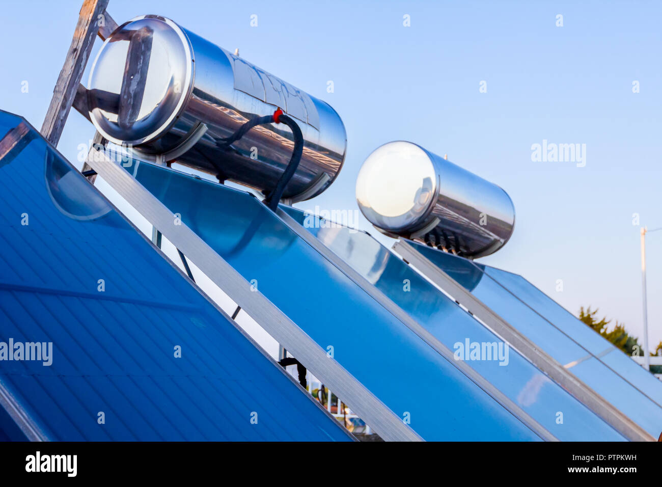 Water panels for using renewable sun energy are placed on house roof ...