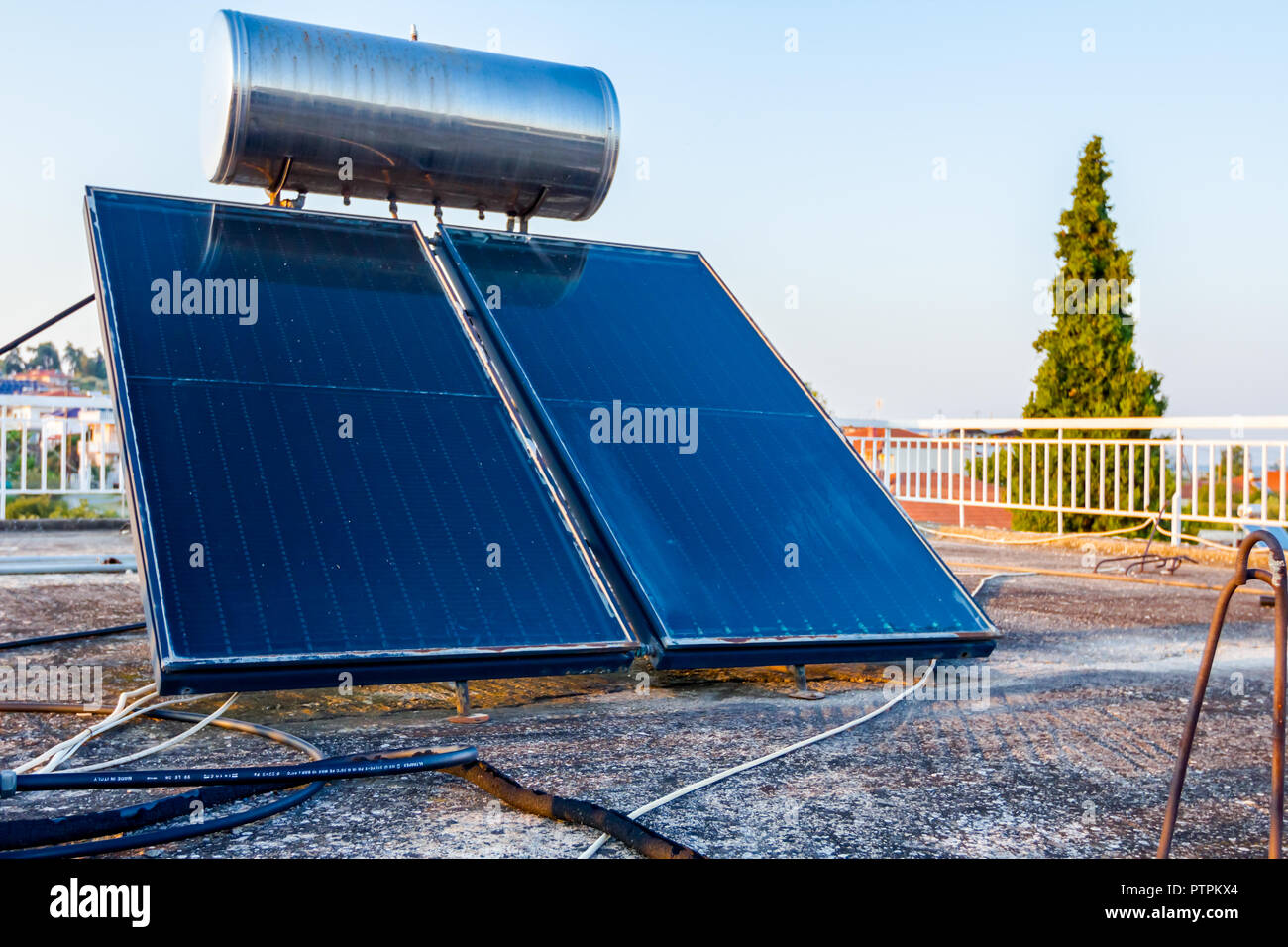 Water panels for using renewable sun energy are placed on house roof ...