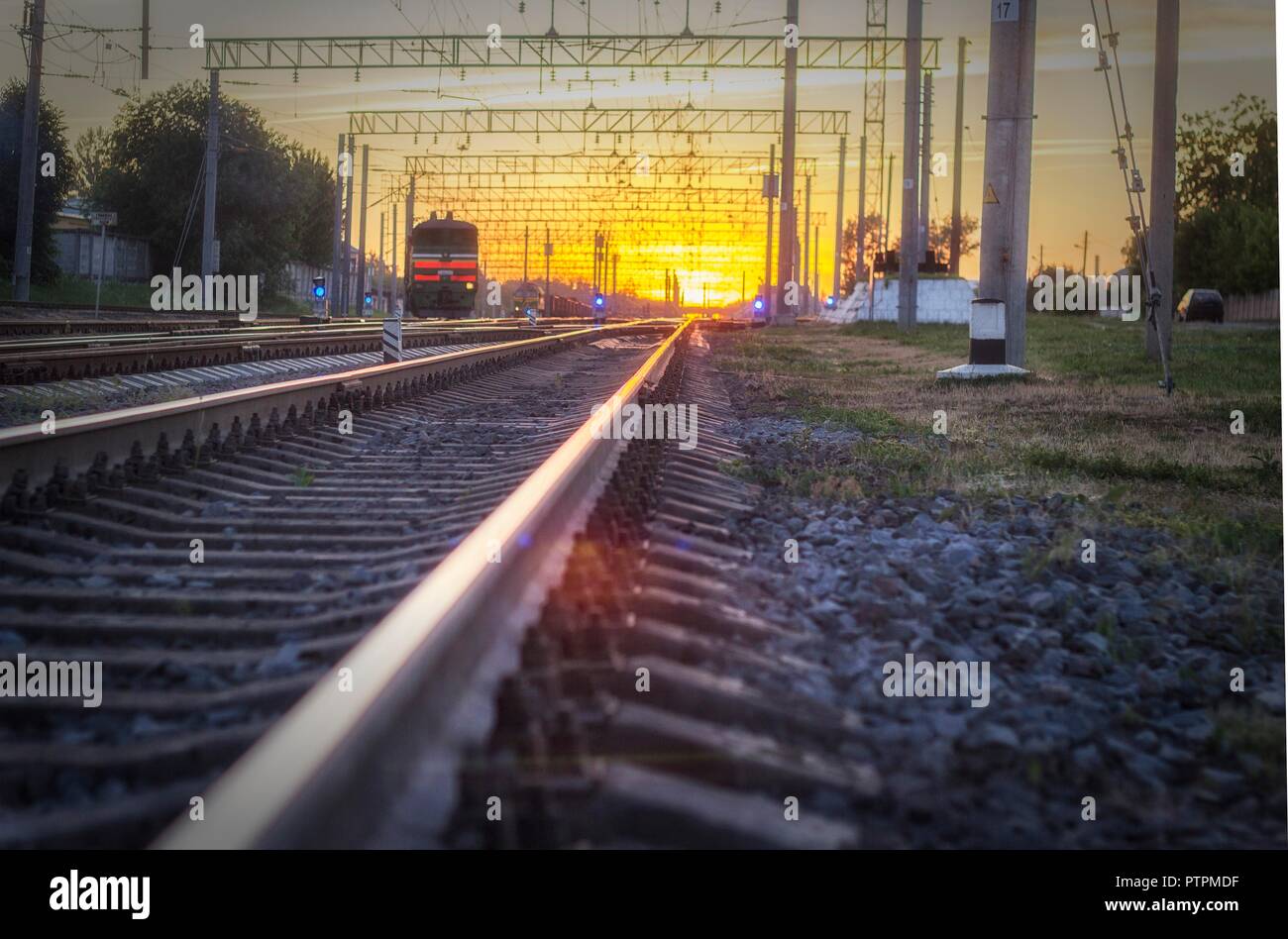 Railway in the background of an orange sunset, in the background a ...