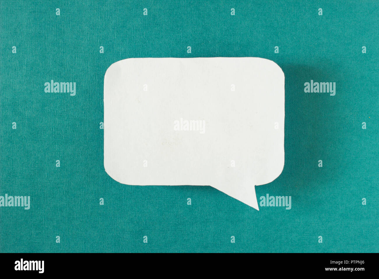 Symbol sign message from a white paper on a turquoise background ...